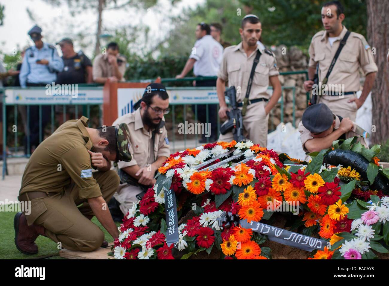 Jerusalem. 11th Nov, 2014. People mourn as Israeli soldiers carry the ...
