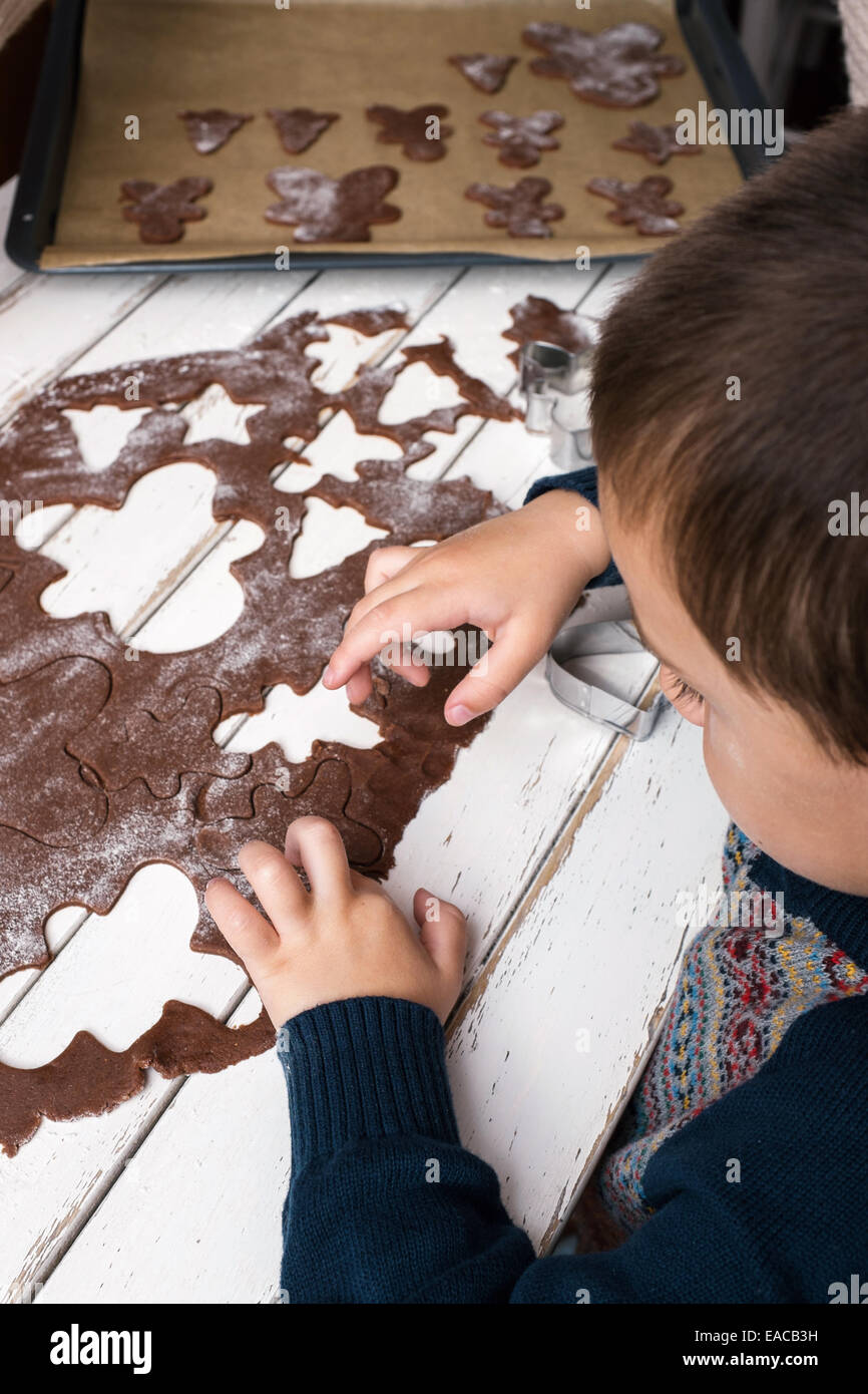 Little boy making gingerbread men Stock Photo - Alamy