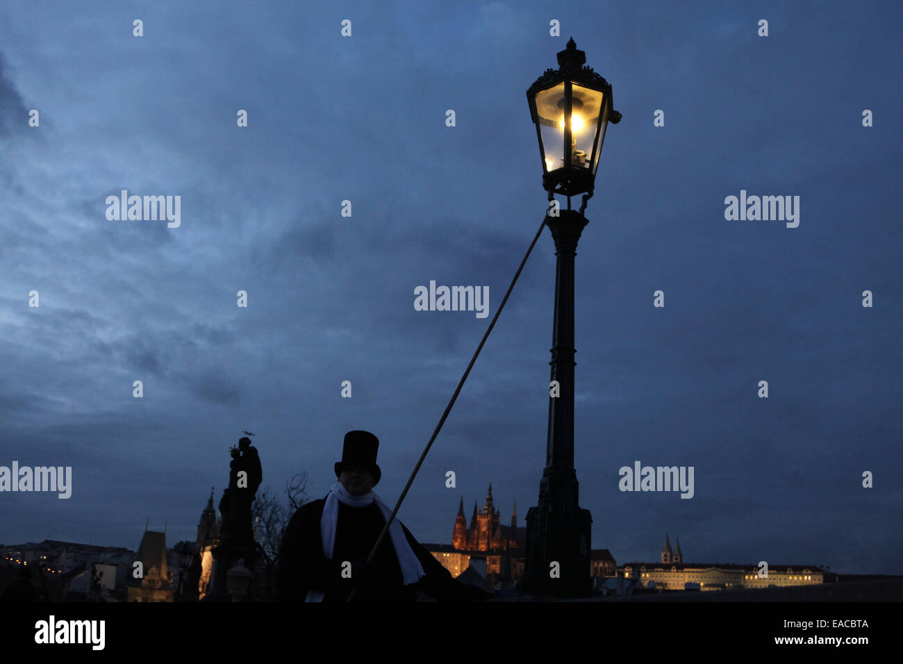 Lamplighter lights a street gas light manually during the Advent time ...
