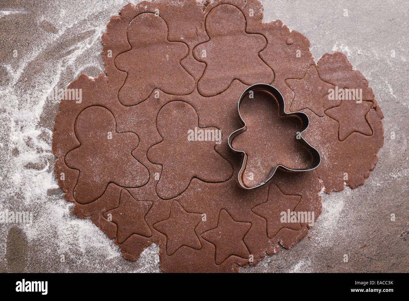 Brown dough and gingerbread man cutter Stock Photo - Alamy