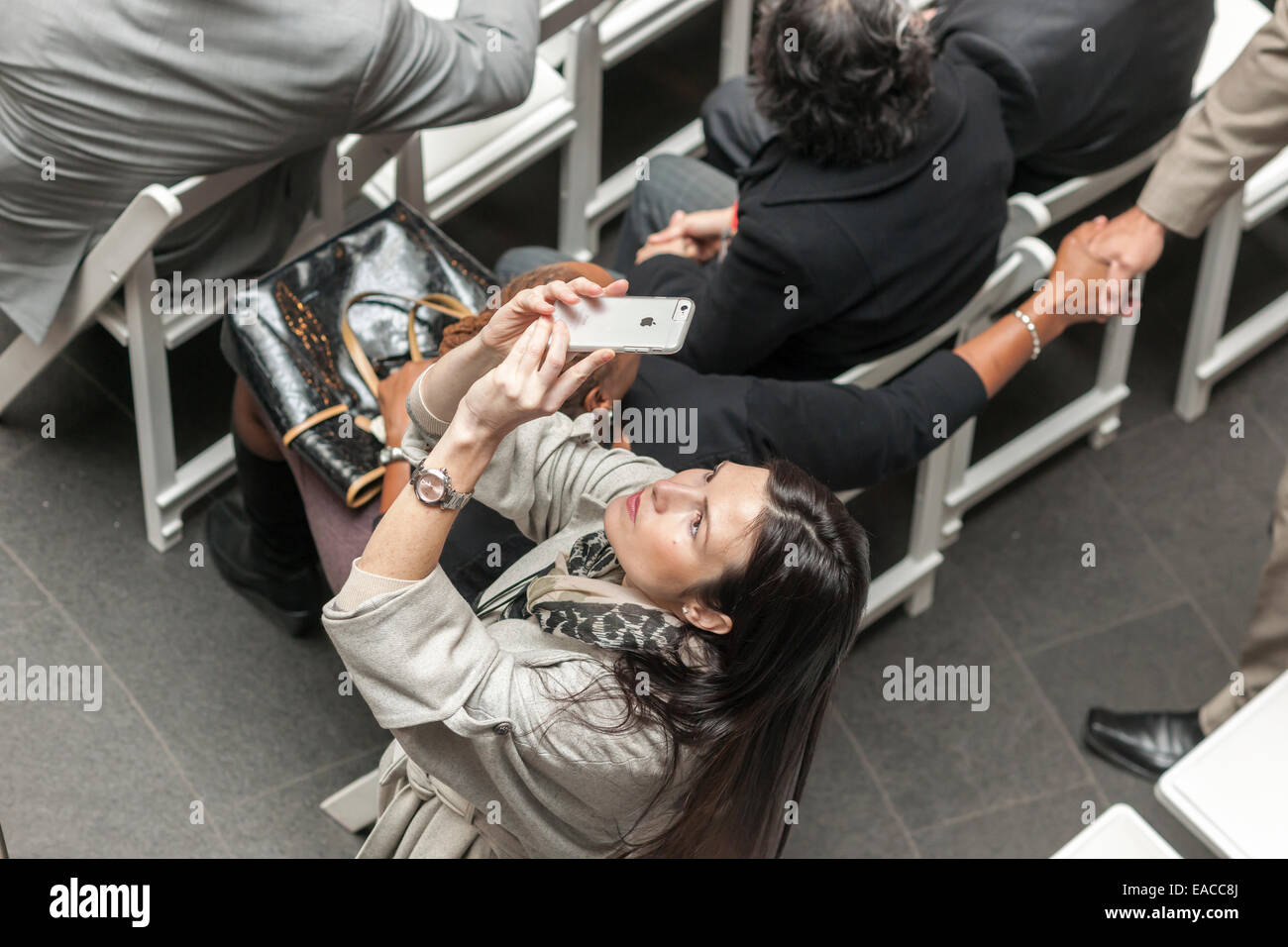 A visitor photographs the Sky Reflector-Net, the centerpiece of the new ...
