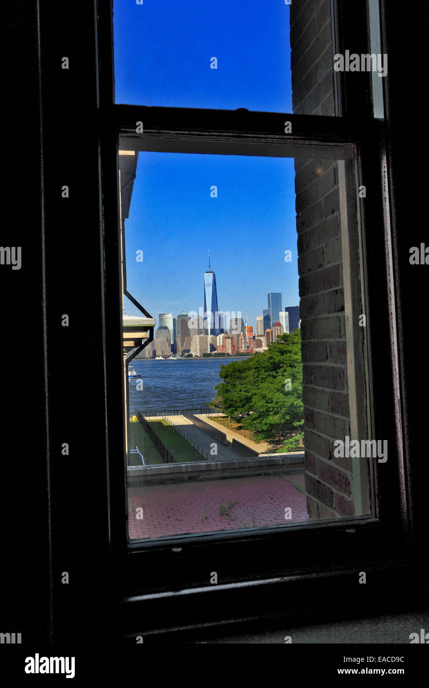 View of the Freedom Tower and lower Manhattan through a window at Ellis ...