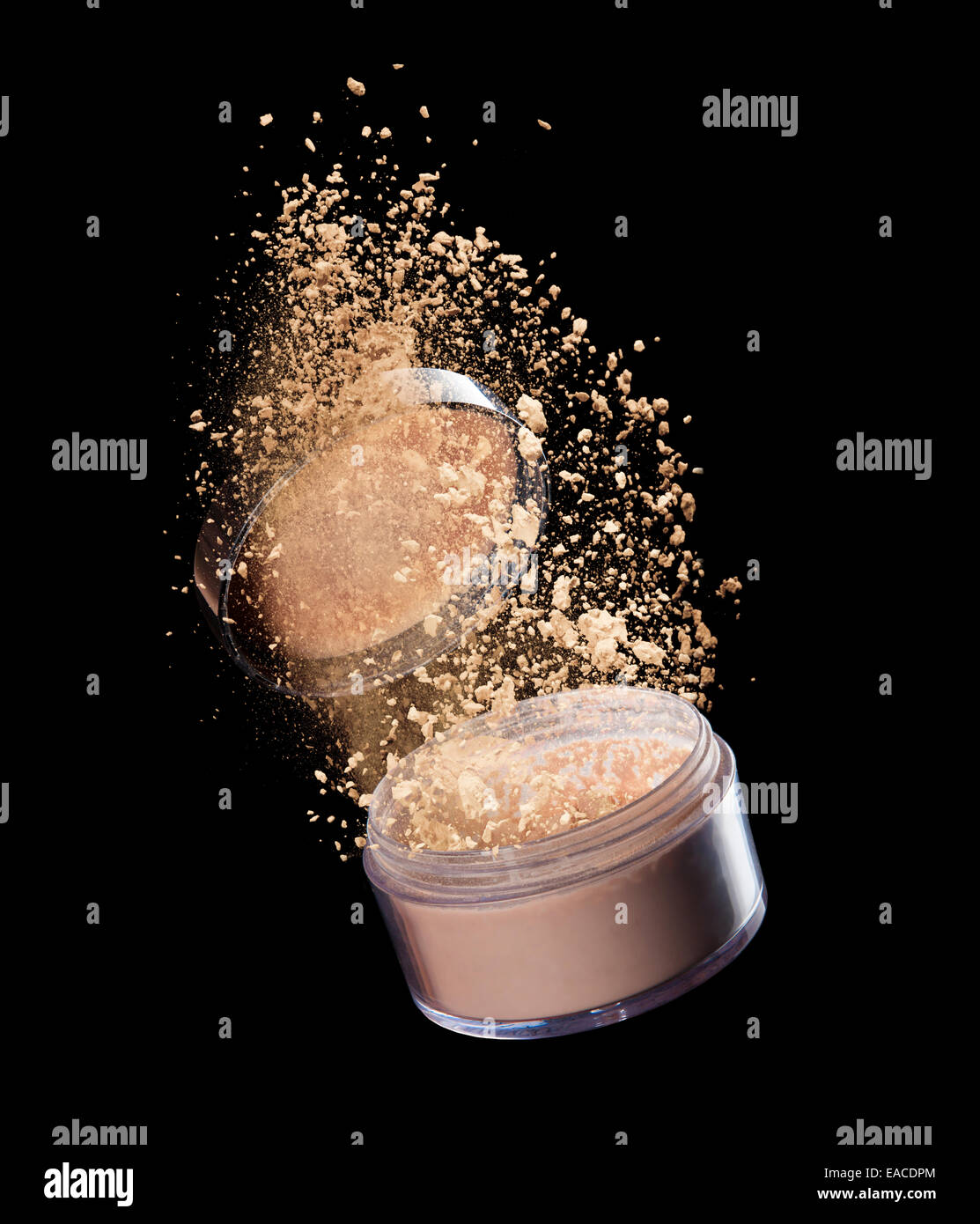 Isolated make-up powder explosion on black background Stock Photo - Alamy