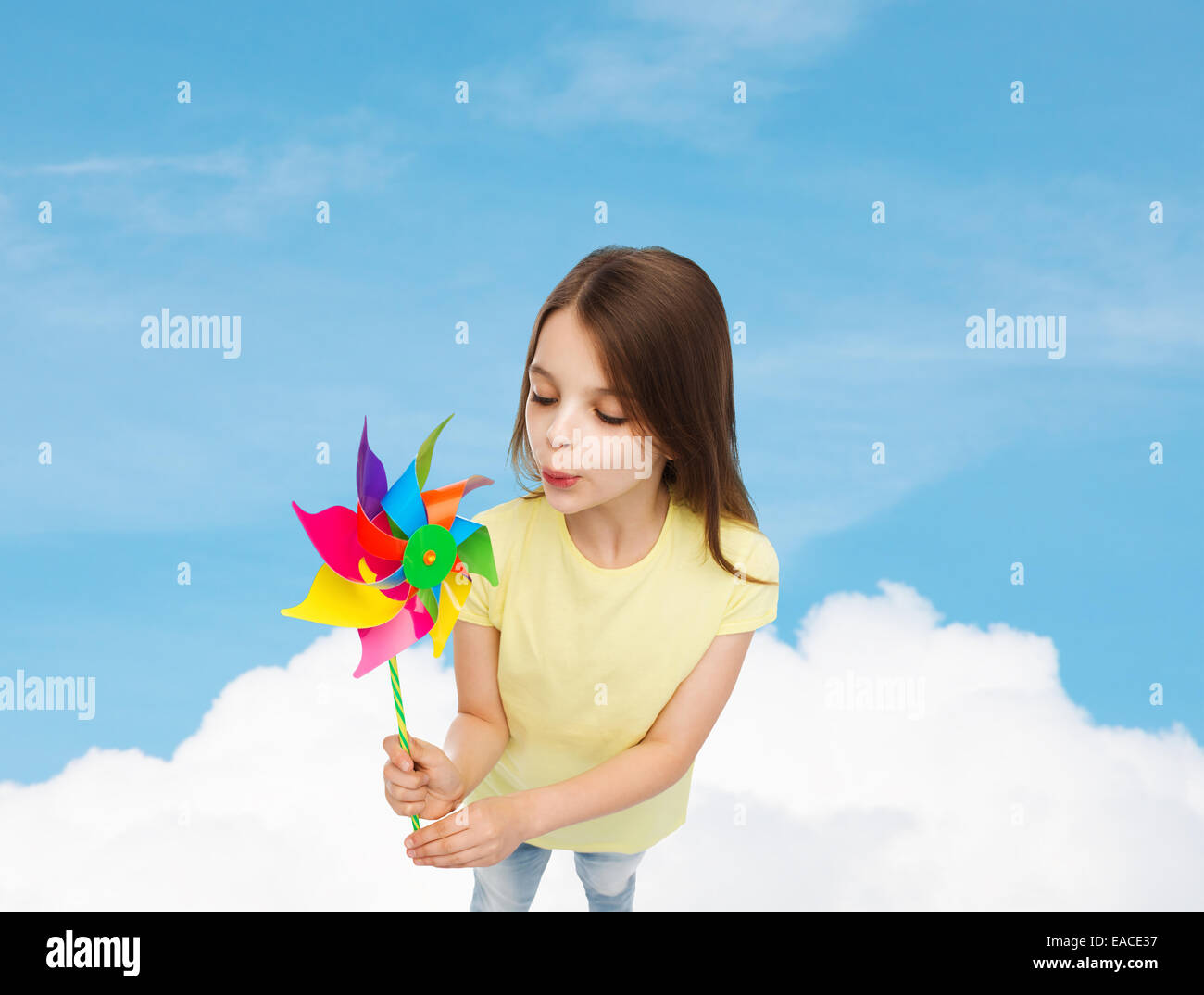smiling child with colorful windmill toy Stock Photo - Alamy