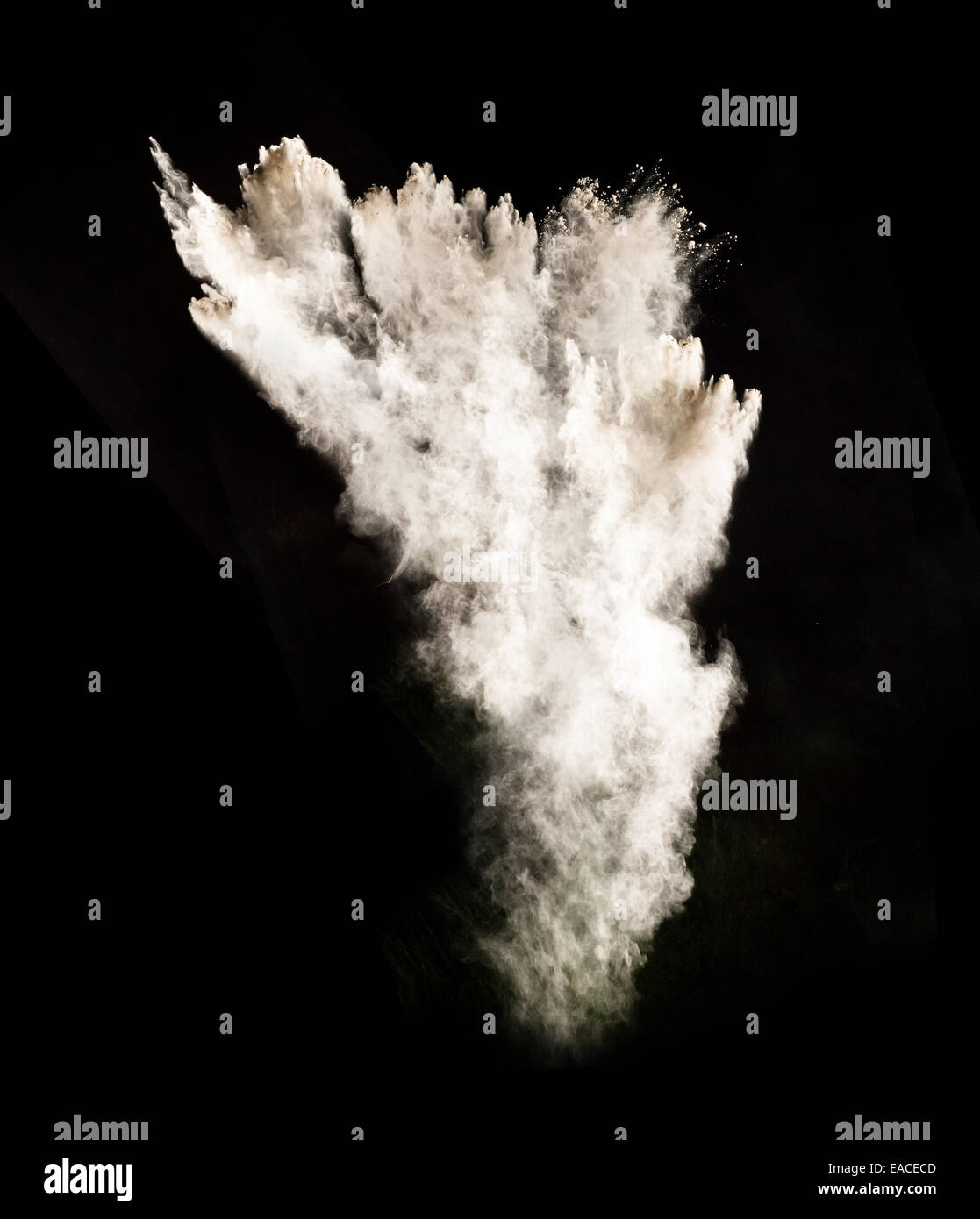 Freeze motion of white dust explosion isolated on black background ...