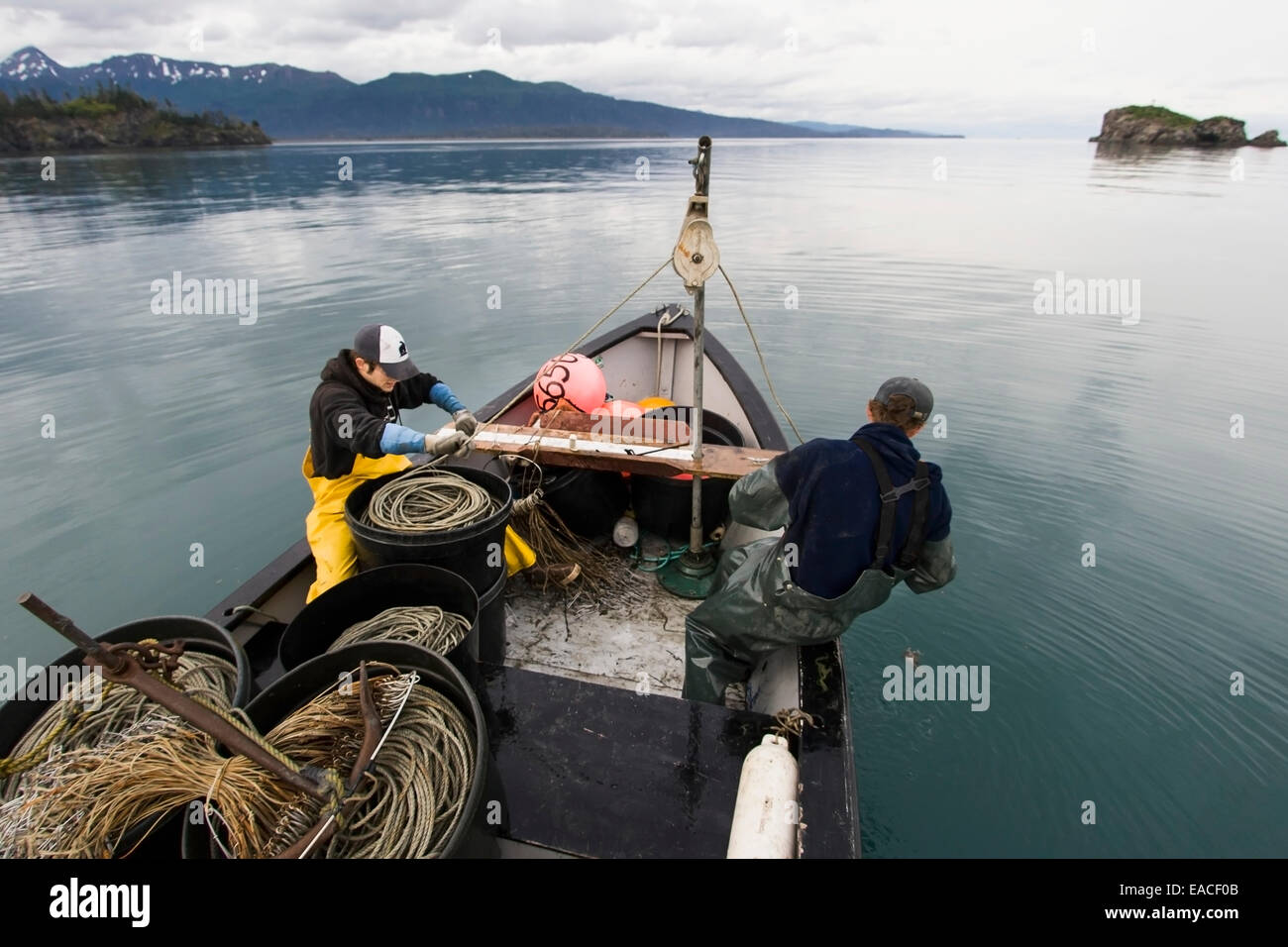 Commercial halibut fishing by hand using longline gear out of an open ...