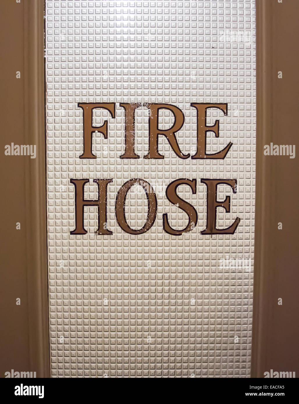 Painted words mark that a closet holds a fire hose Stock Photo - Alamy