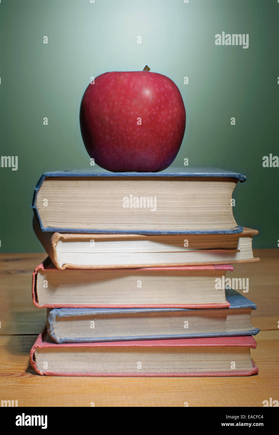 Book and apple hi-res stock photography and images - Alamy