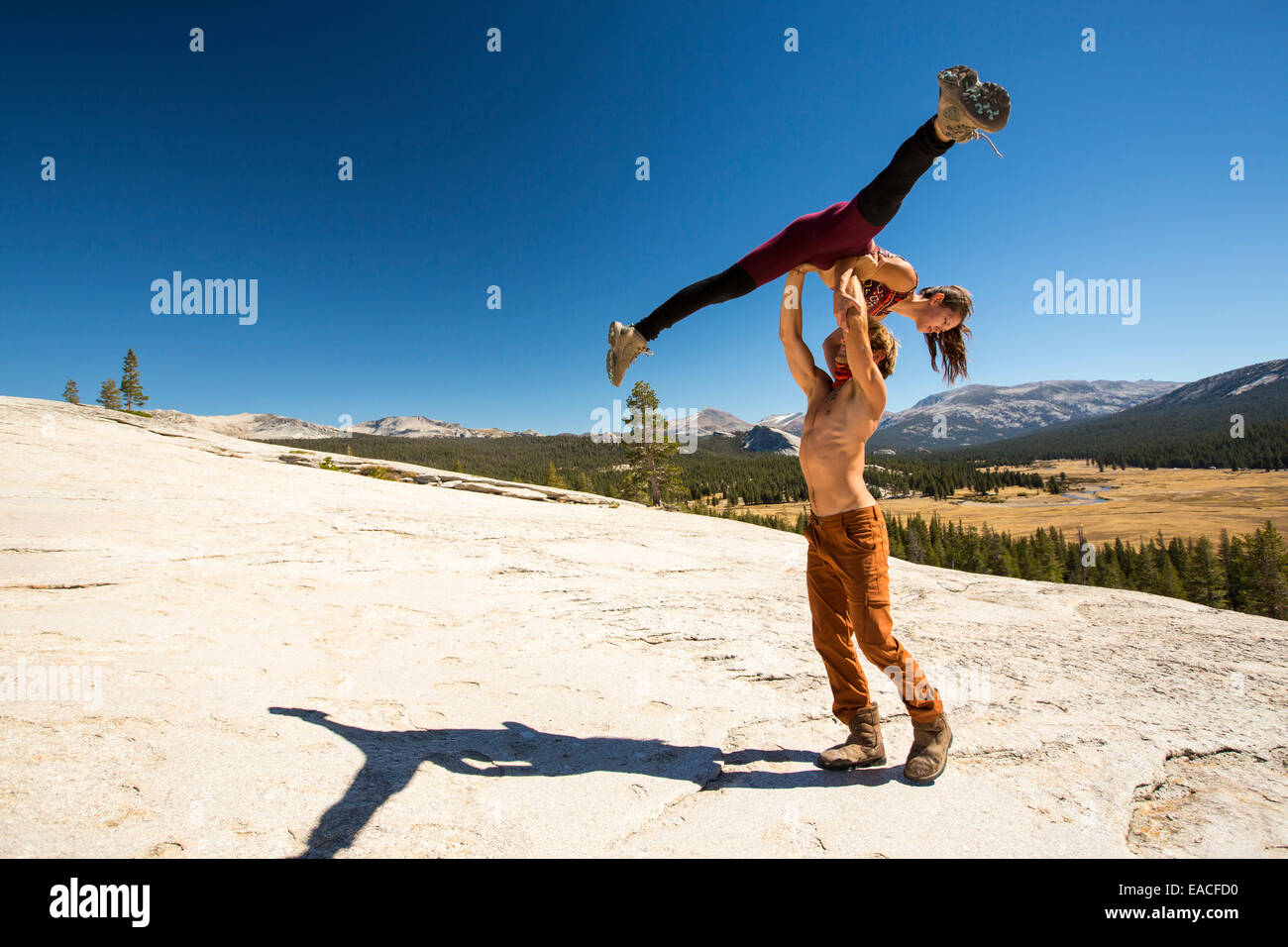 Nicholas Coolridge and his partner Eve, perform moves on a granite dome ...