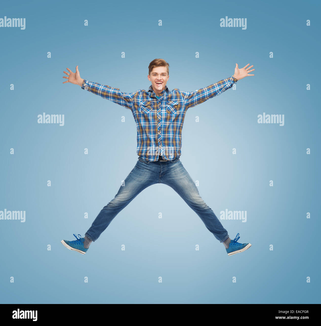 smiling young man jumping in air Stock Photo - Alamy