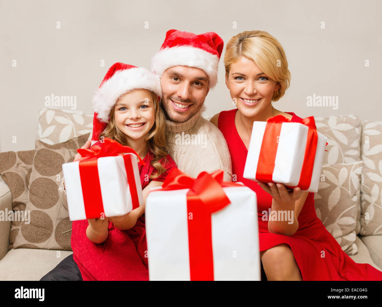 smiling family giving many gift boxes Stock Photo - Alamy