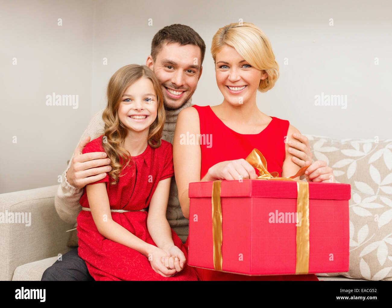 happy family opening gift box Stock Photo - Alamy