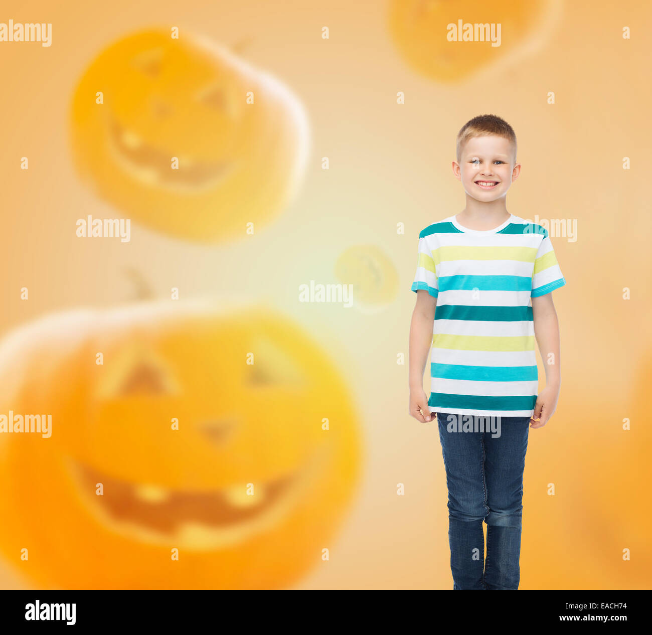 smiling boy over pumpkins background Stock Photo - Alamy