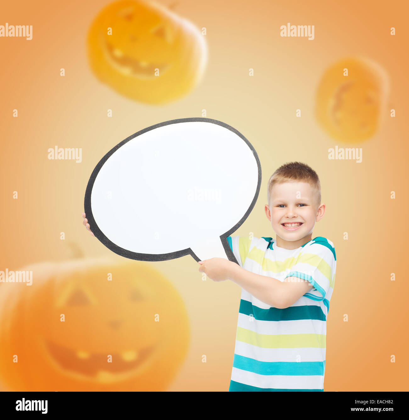 smiling little boy holding big white text bubble Stock Photo - Alamy