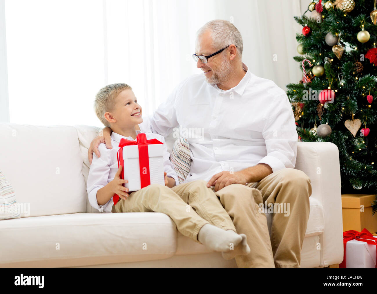 smiling grandfather and grandson at home Stock Photo - Alamy