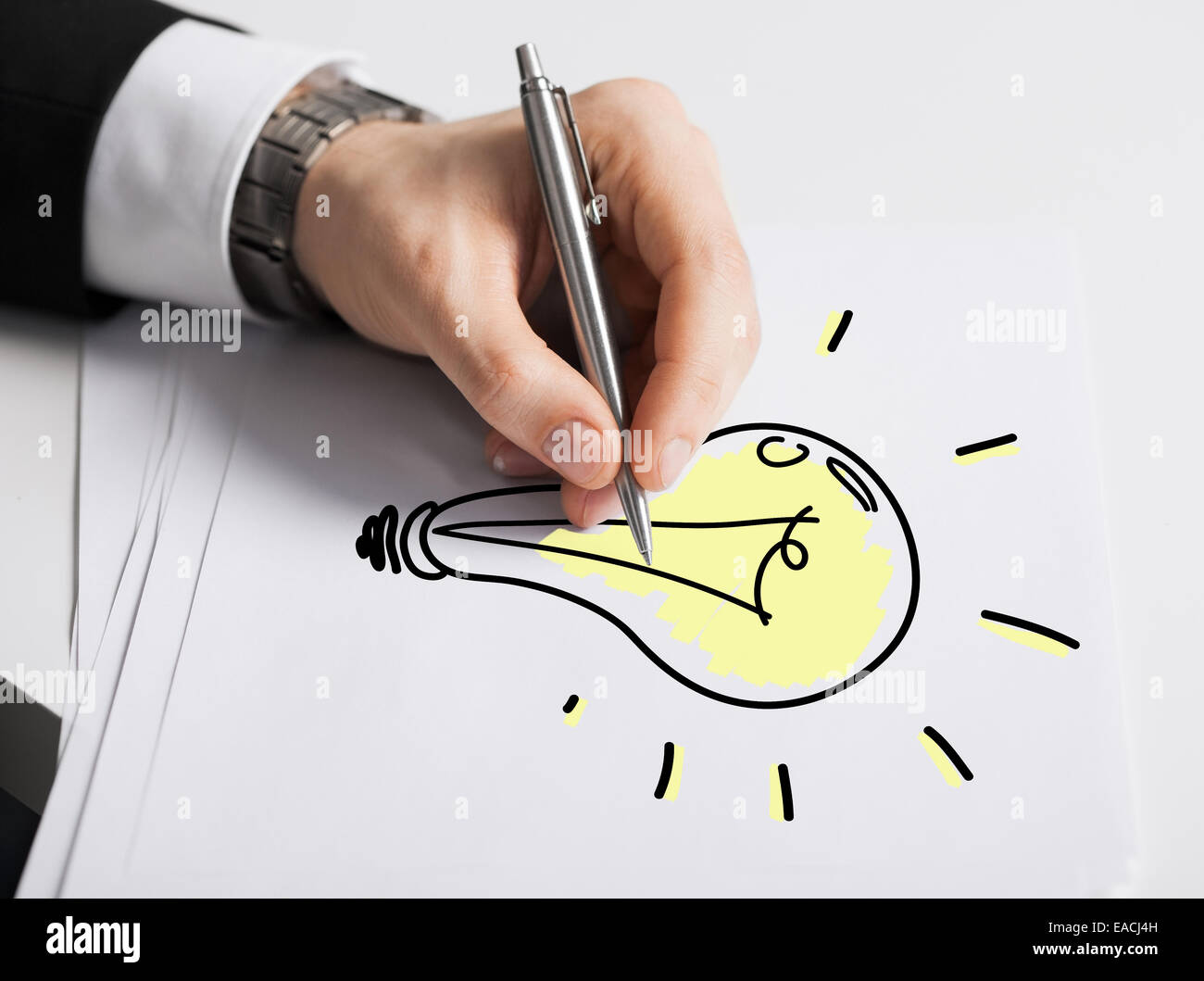 close up of male hand with pen drawing bulb Stock Photo - Alamy
