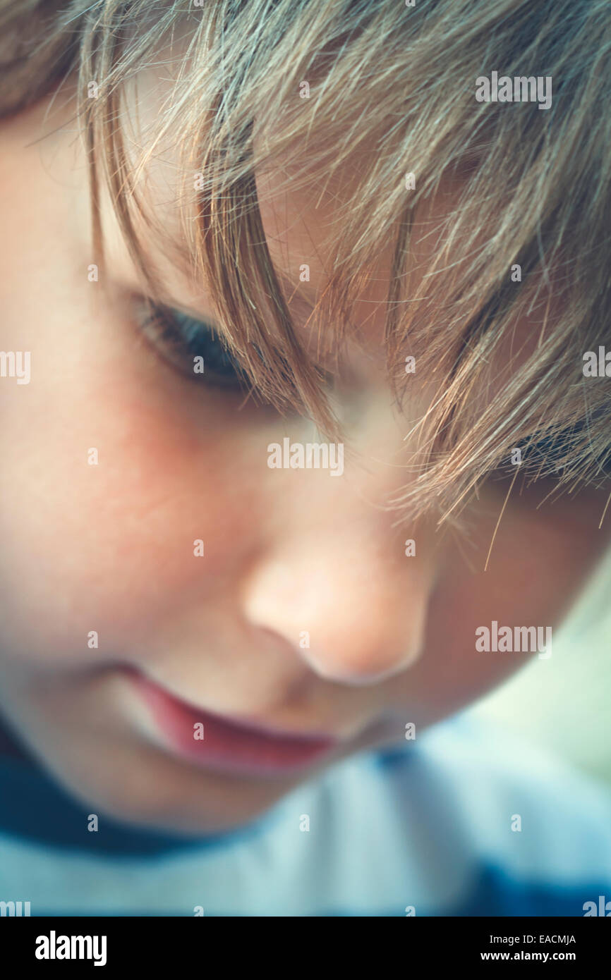 Boy looking down hi-res stock photography and images - Alamy