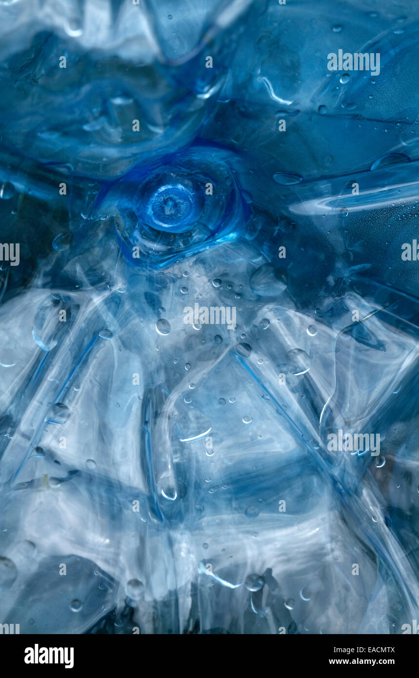 abstract background, plastic bottle of water compressed, droplets ...