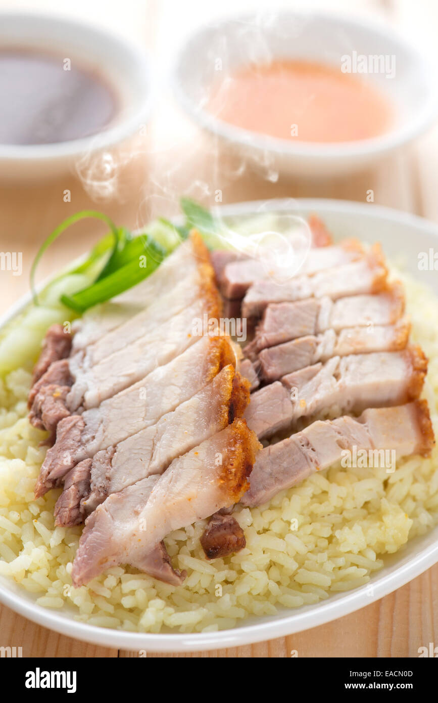 Chinese crispy roasted belly pork rice. Fresh cooked with hot steam and ...