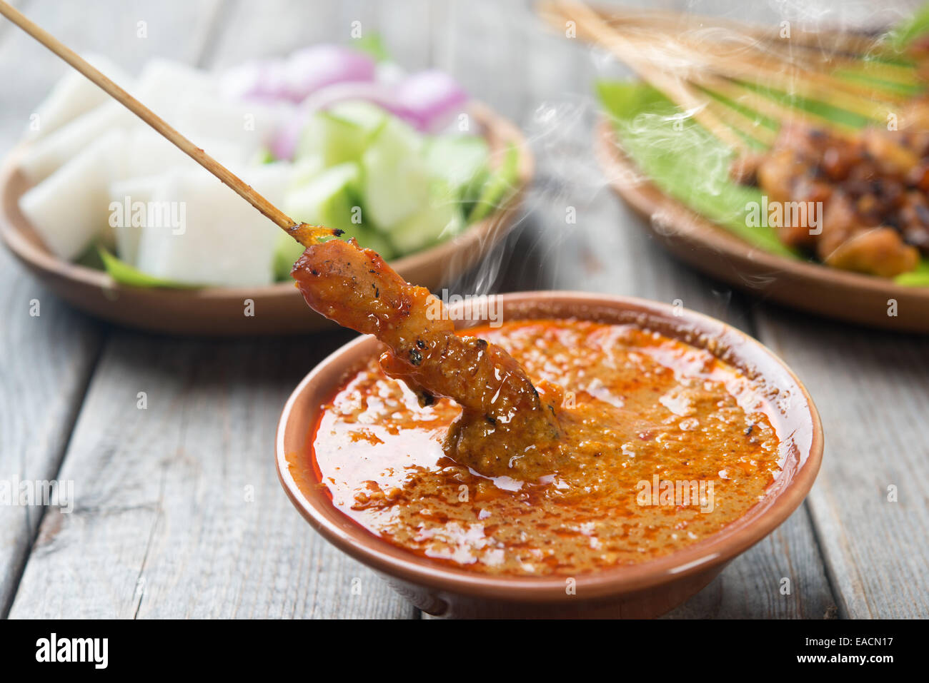 Hot and spicy Asian dish. Yummy chicken sate or satay, skewered and ...
