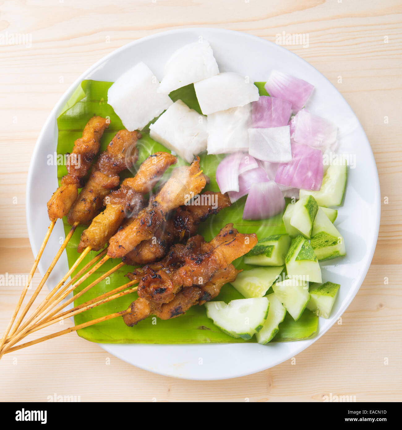 Skewered and grilled meat , chicken sate or satay, served with peanut ...