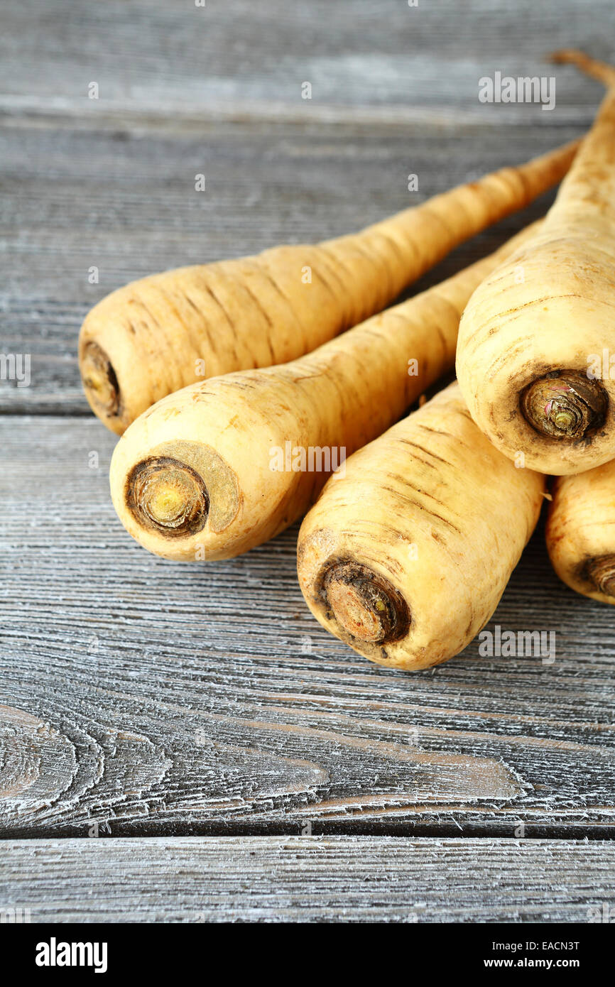 Raw Parsnip on wooden boards, food Stock Photo - Alamy