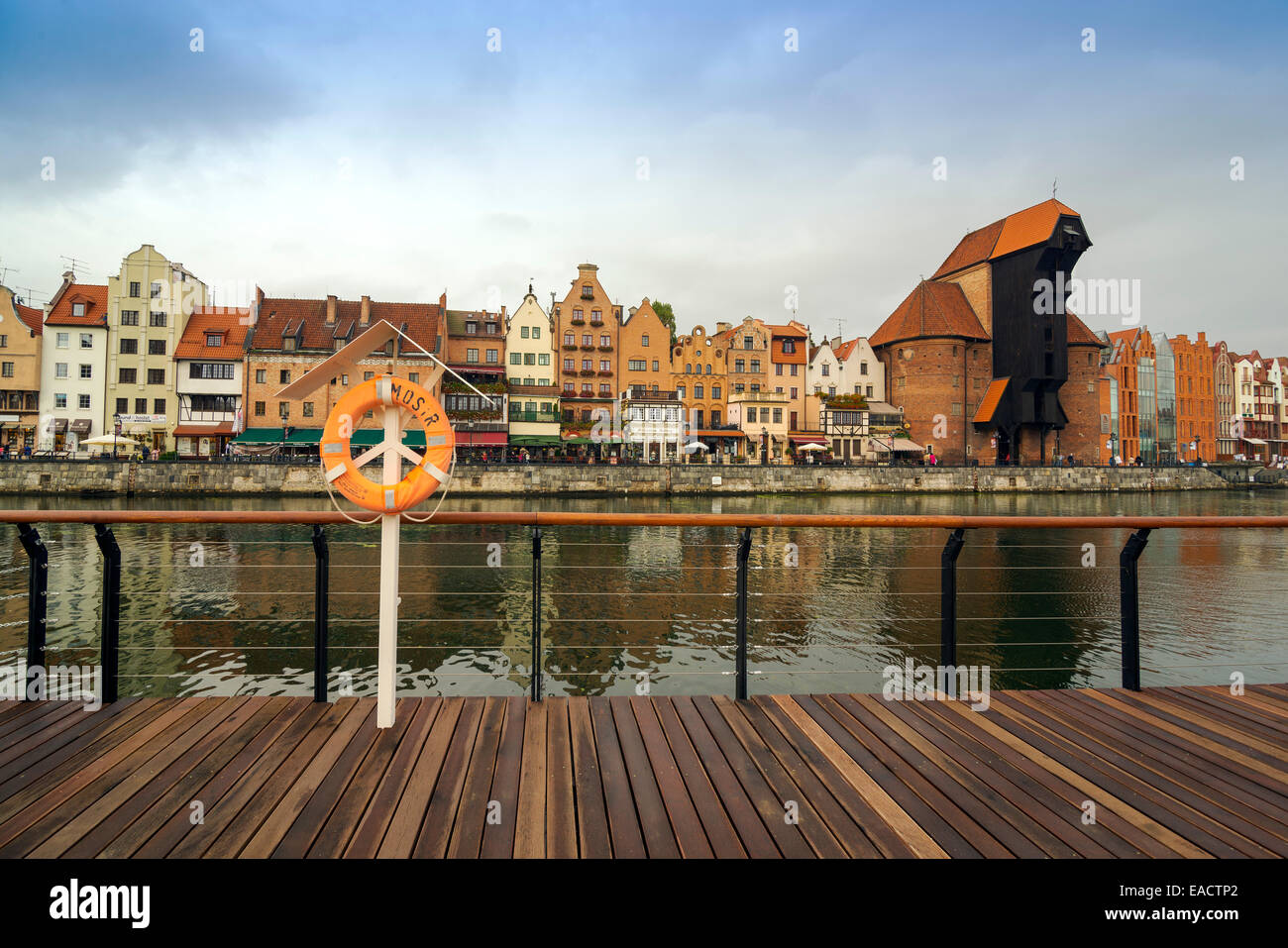 The classic view of Gdansk with the Hanseatic-style buildings reflected ...