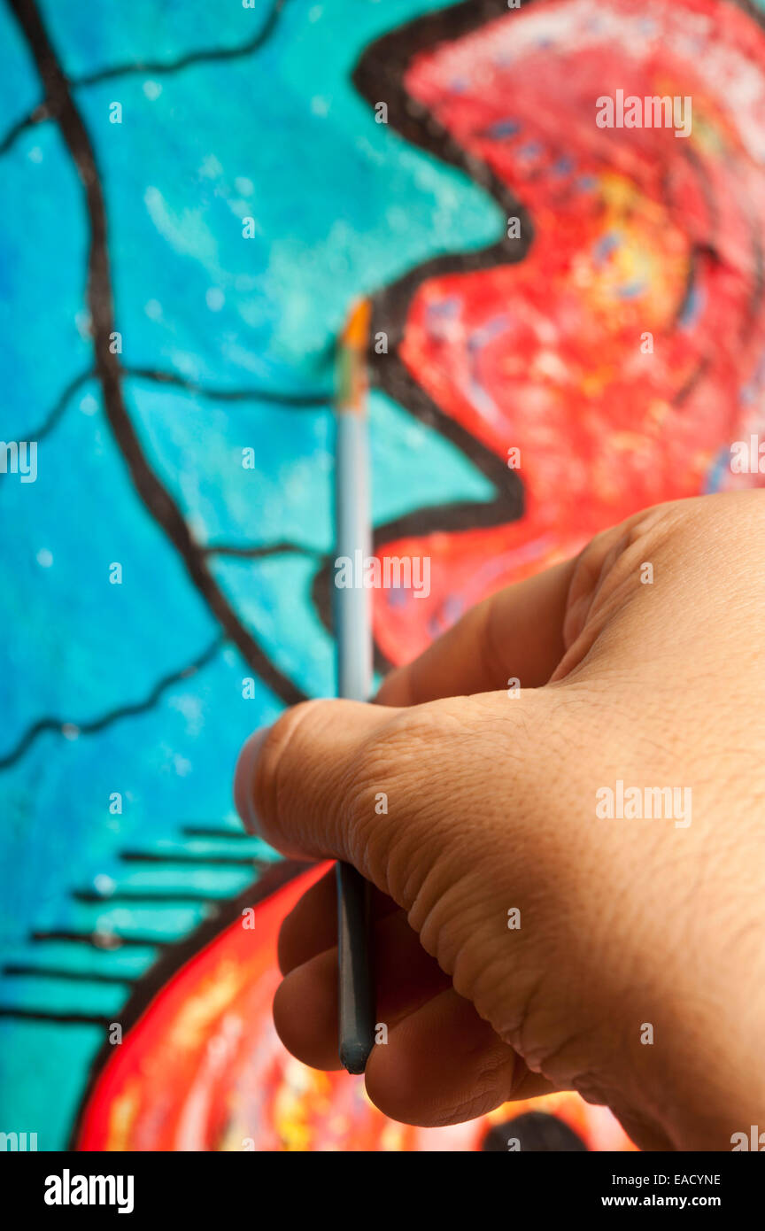 close up detail of a painter finishing an artwork Stock Photo - Alamy