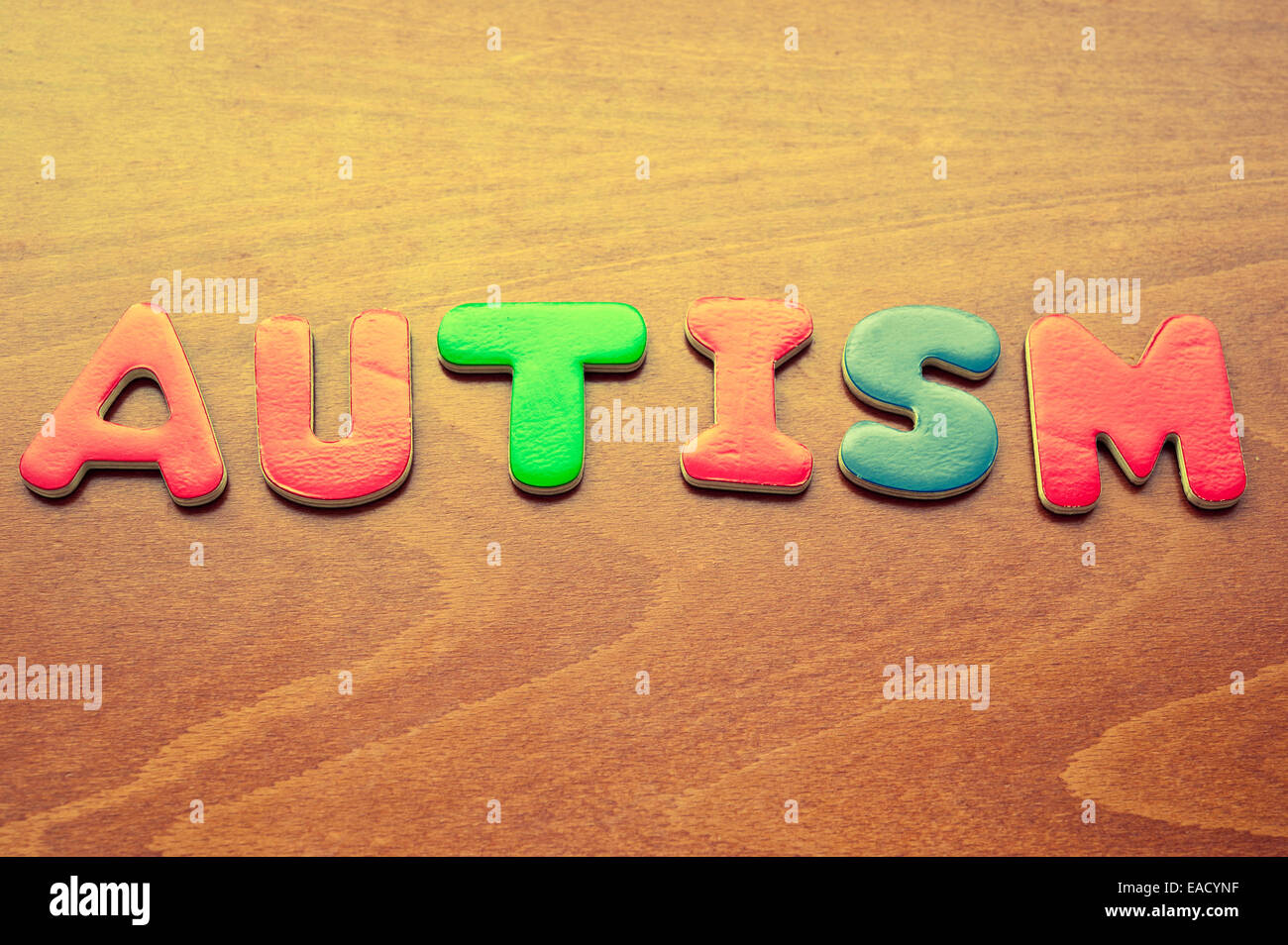word autism written with colorful kids magnetic letters Stock Photo - Alamy