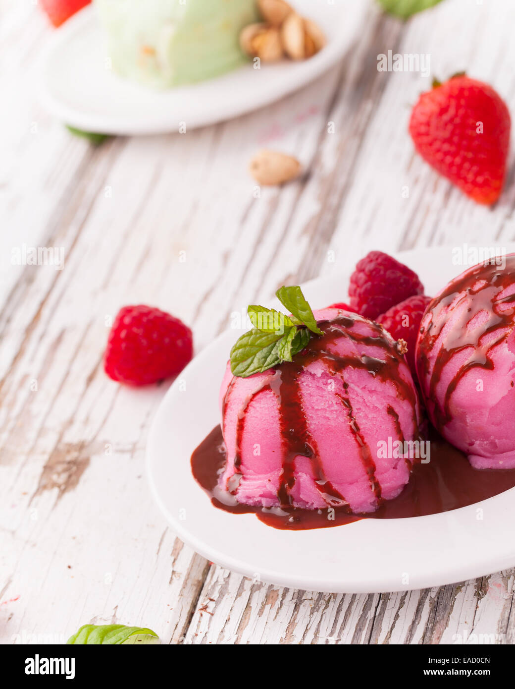 Strawberry ice cream in sundae on wooden table Stock Photo - Alamy