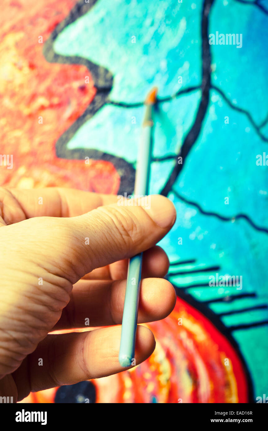 close up detail of a painter finishing an artwork Stock Photo - Alamy
