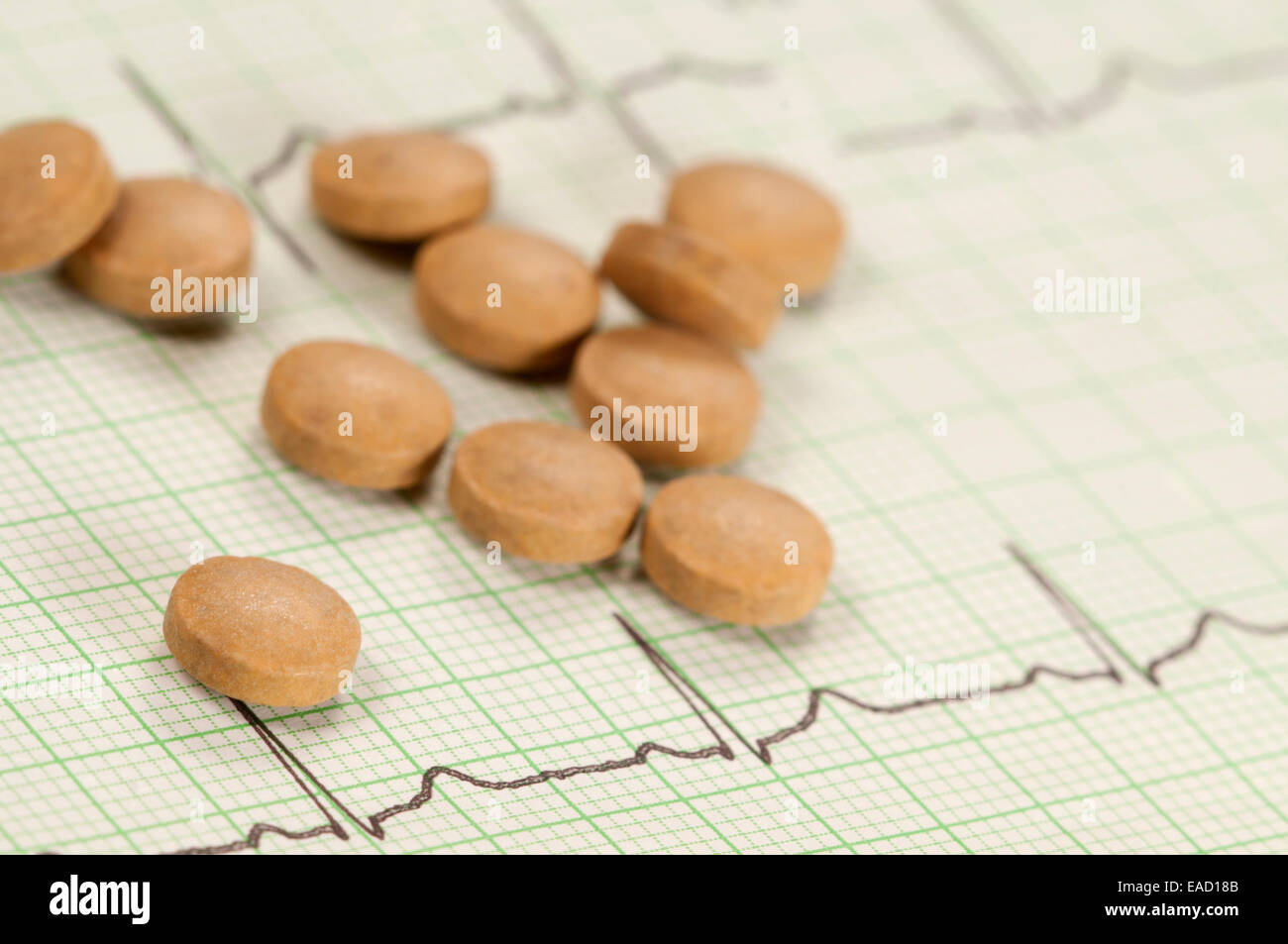 Tablets on electrocardiogram paper, closeup shot, local focus Stock ...