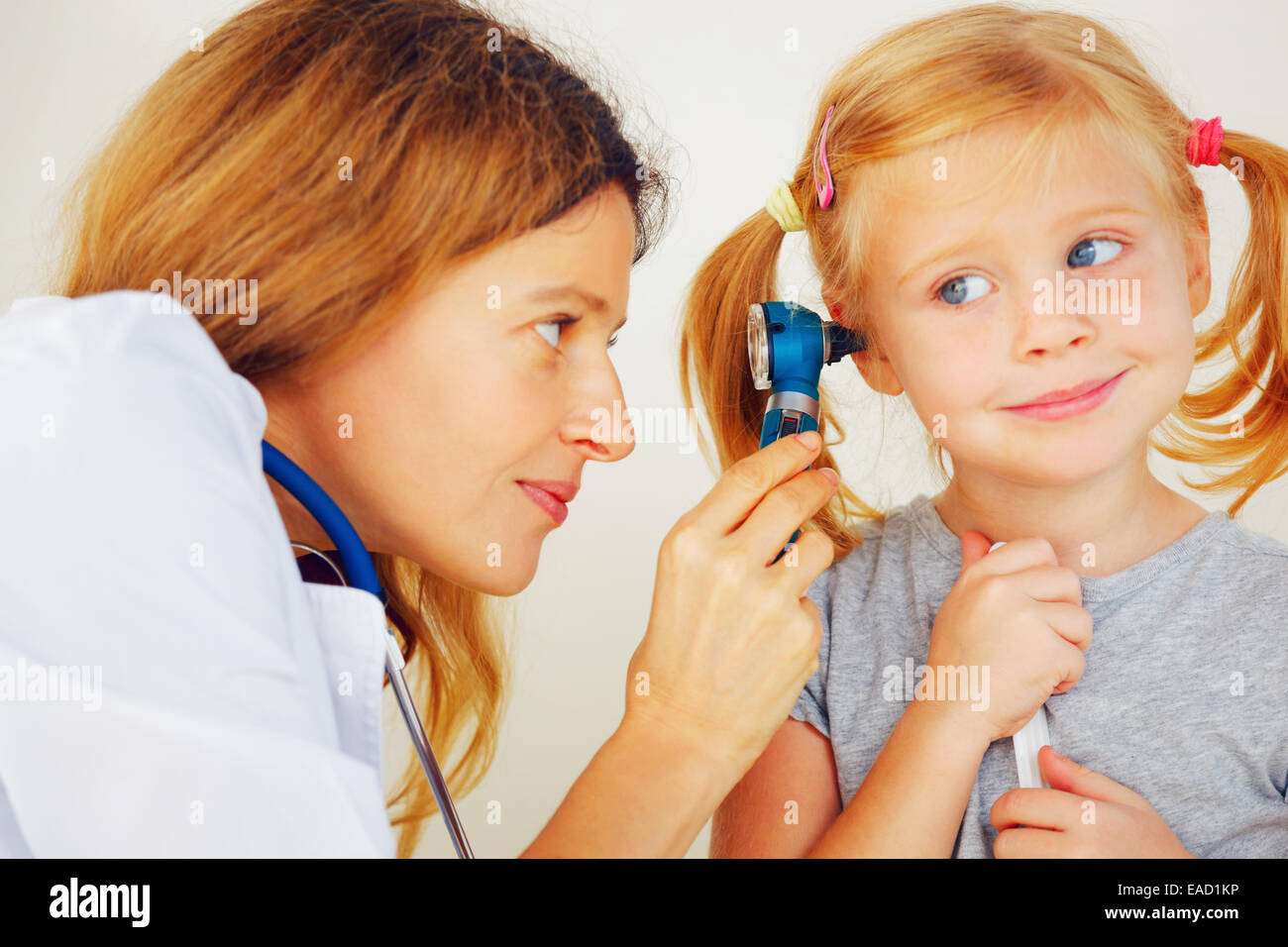 Doctor Checking Patient Ears Stock Photos & Doctor Checking Patient ...