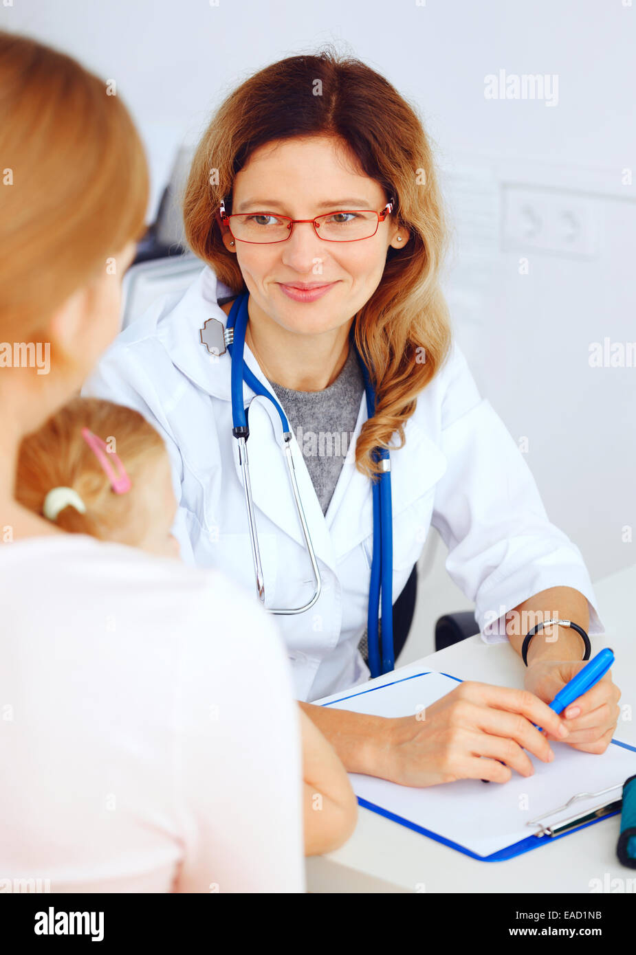 Visit to pediatrician. Happy child with her mother visiting doctor ...