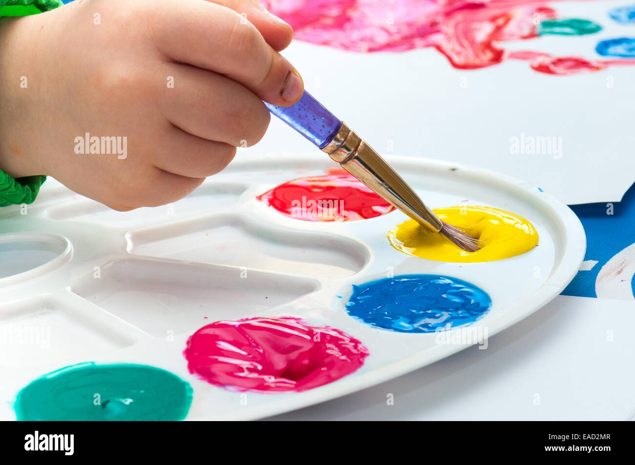 Hand of child painting with brush Stock Photo - Alamy