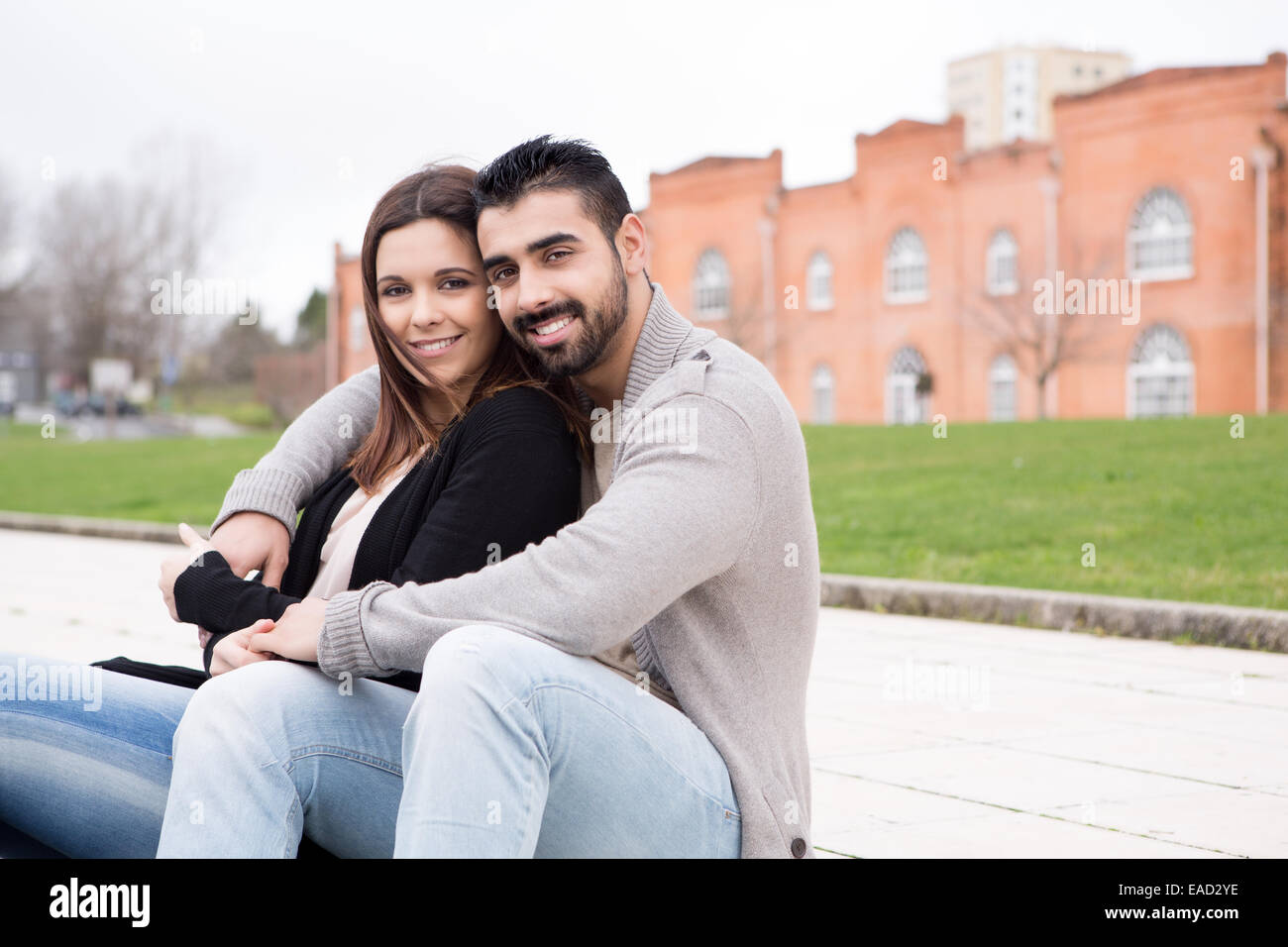 Lovely couple hugging each other in a park Stock Photo - Alamy