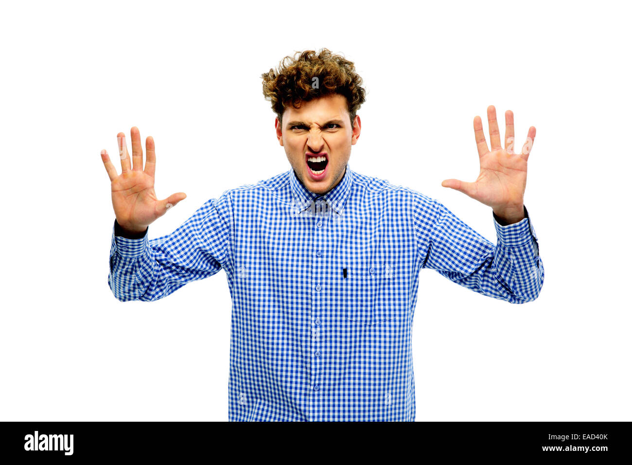 Portrait of angry young man with raising hands up Stock Photo - Alamy