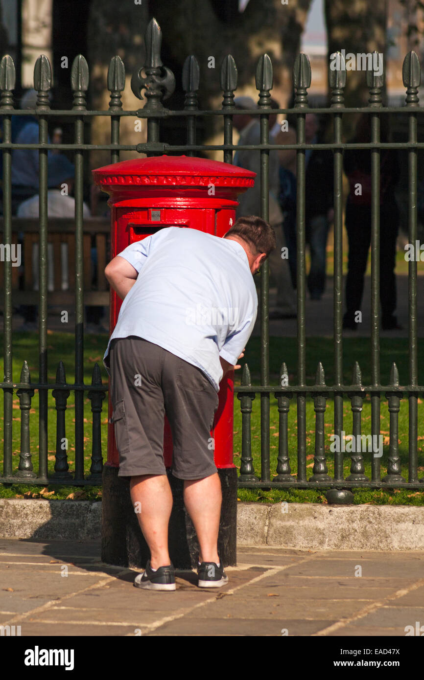 Postman emptying post box at Greenwich, London UK in September Stock ...