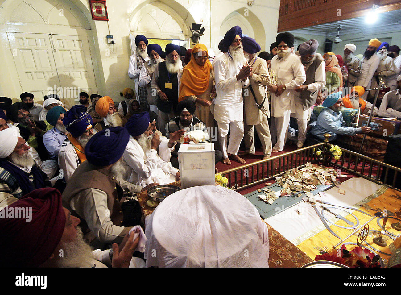 Lahore. 12th Nov, 2014. Indian Sikh devotees attend a religious ritual ...