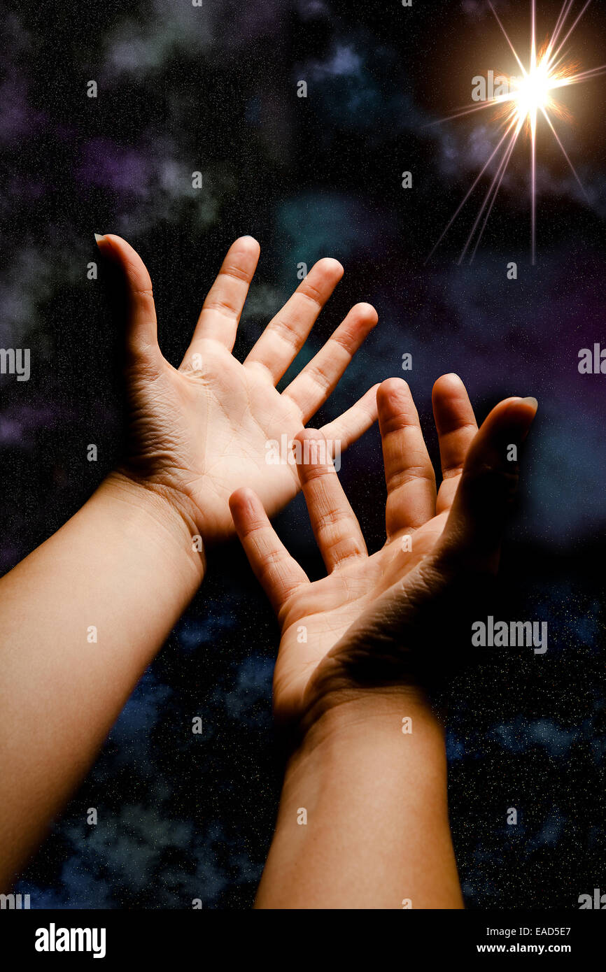 Hands reaching for the star hi-res stock photography and images - Alamy