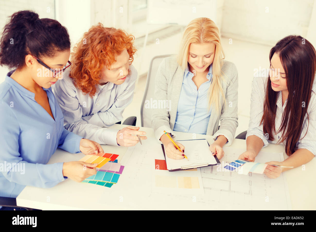 team with color samples and blueprint at office Stock Photo - Alamy