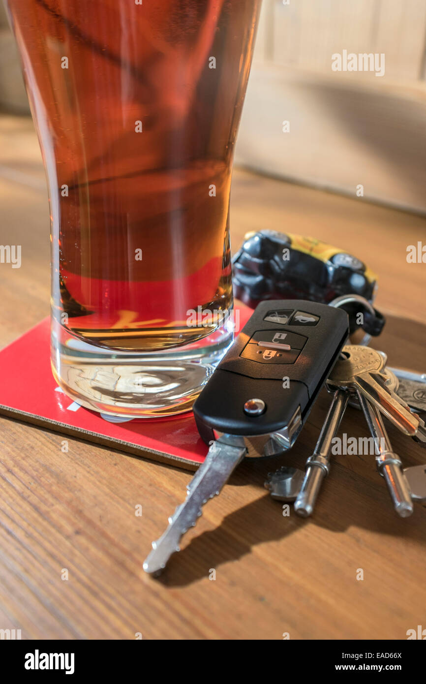 Car keys and a pint of beer Stock Photo - Alamy