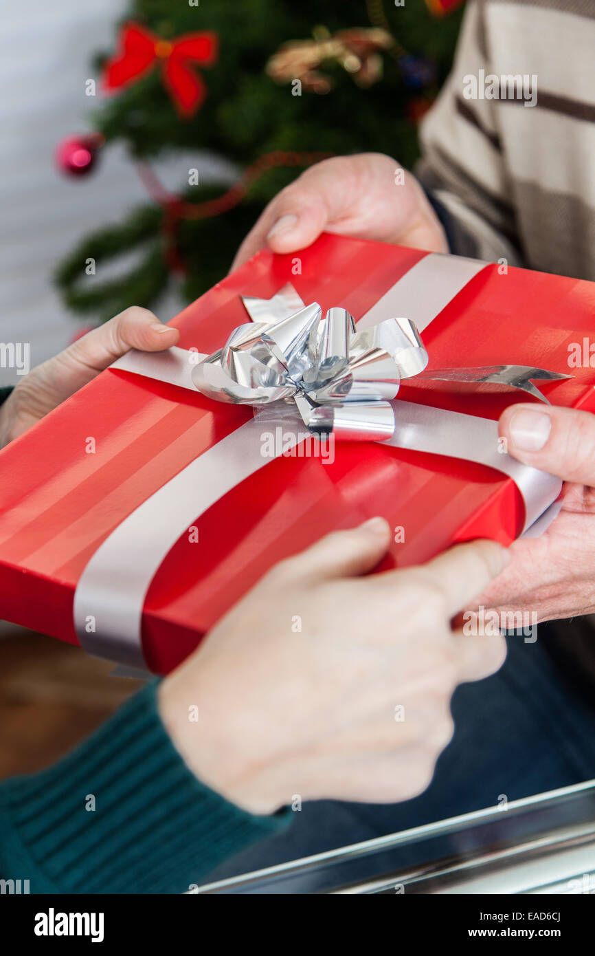Giving a gift Stock Photo - Alamy