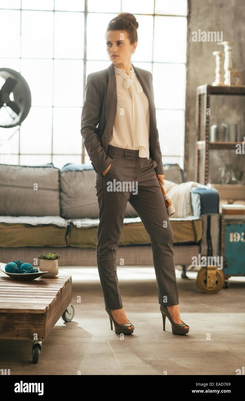 Full length portrait of business woman in loft apartment Stock Photo ...