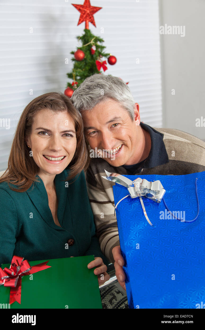 Man and woman with gifts Stock Photo - Alamy