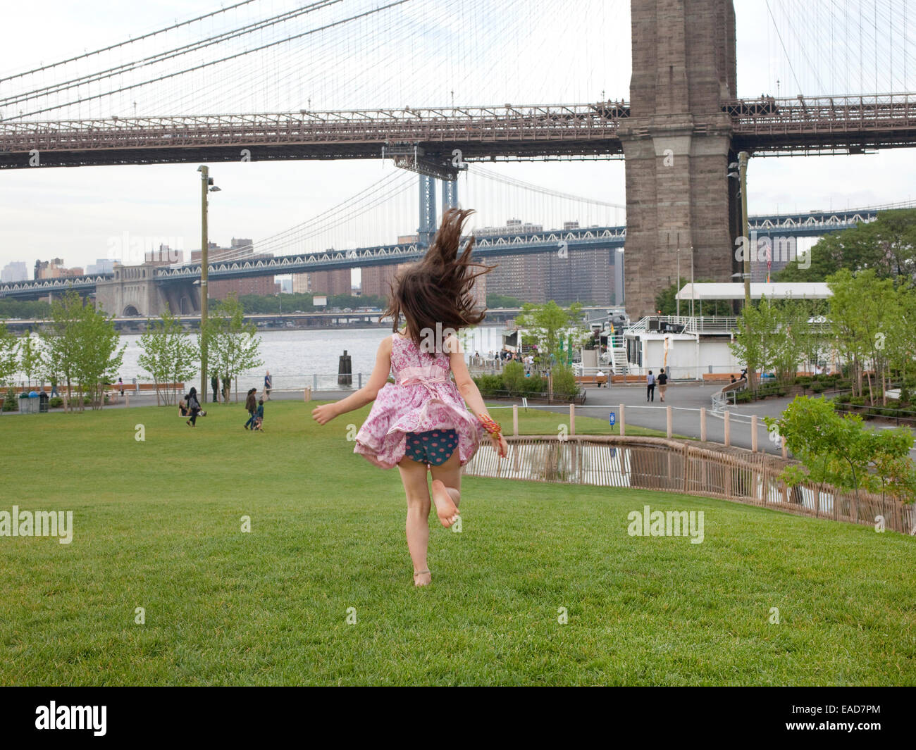 girl running and jumping in park with polka dot bloomers Stock Photo ...