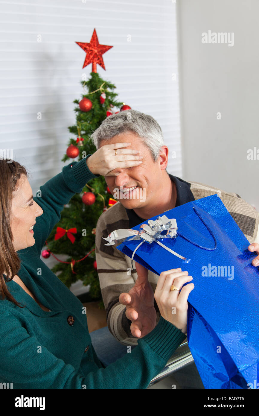 Woman giving gift Stock Photo - Alamy