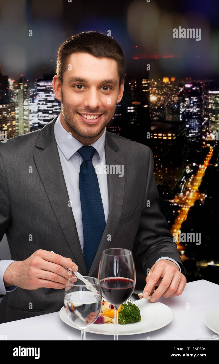 Man eating dinner suit hi-res stock photography and images - Alamy