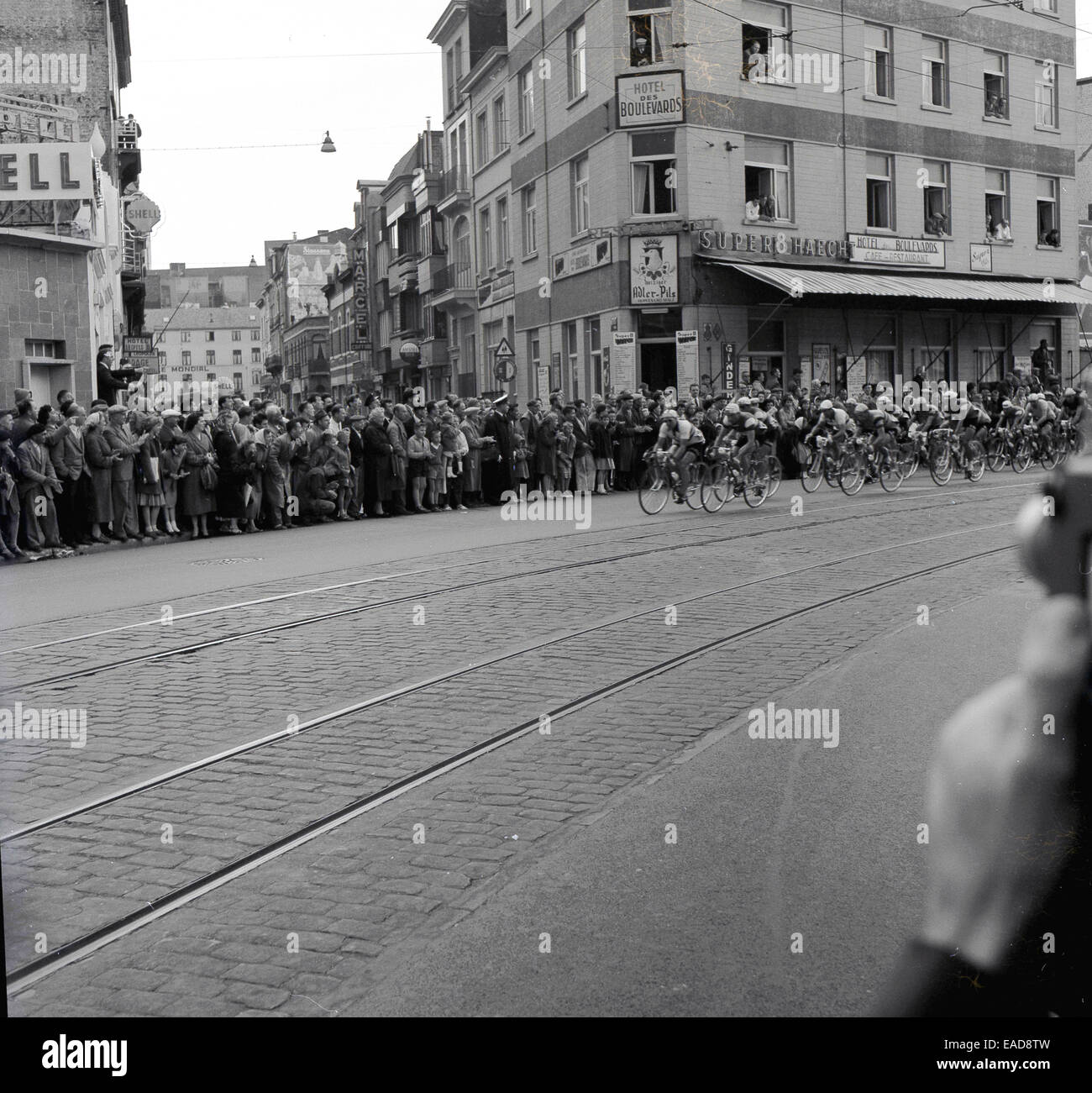 1950s historical picture of a city-centre cycle race, Belgium with ...
