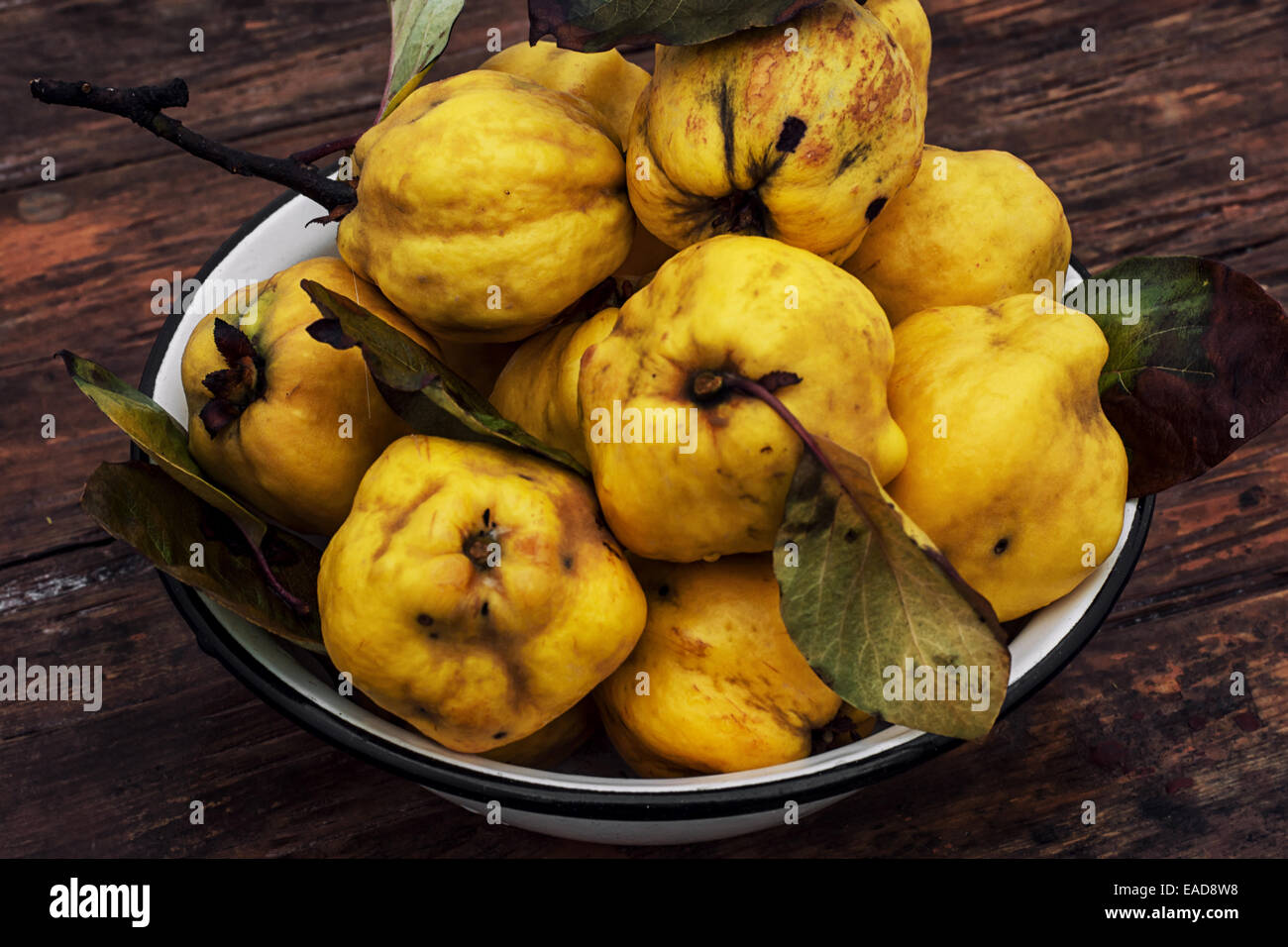 juicy,ripe quince fruit on wooden top Stock Photo - Alamy
